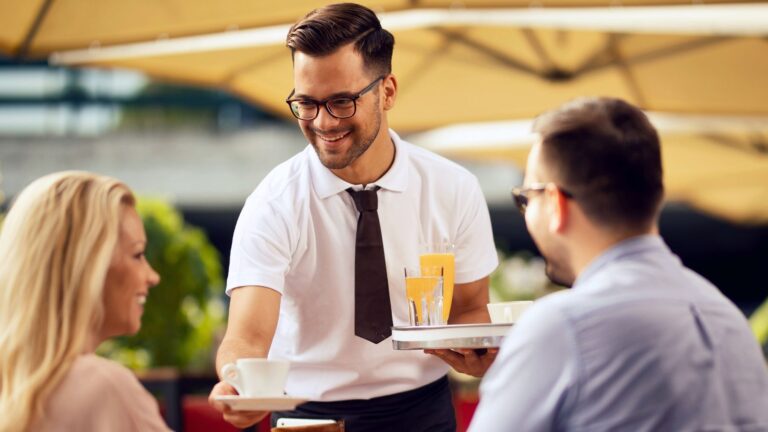 It may seem kind to help a waiter clear the table, but psychologists ...